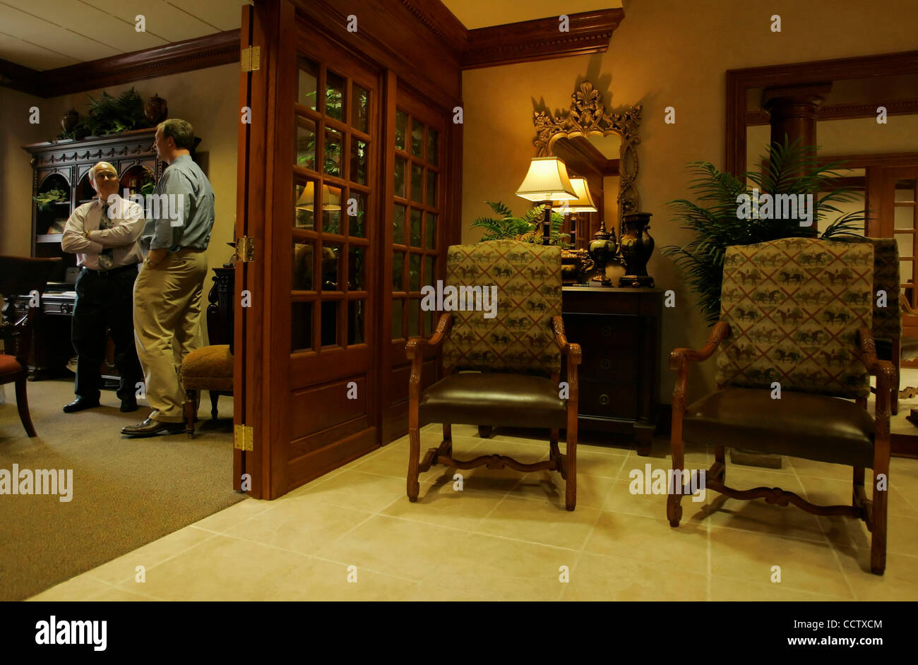 Forcht Bank branch president JOE SHUFFETT (left) discusses the loan ...