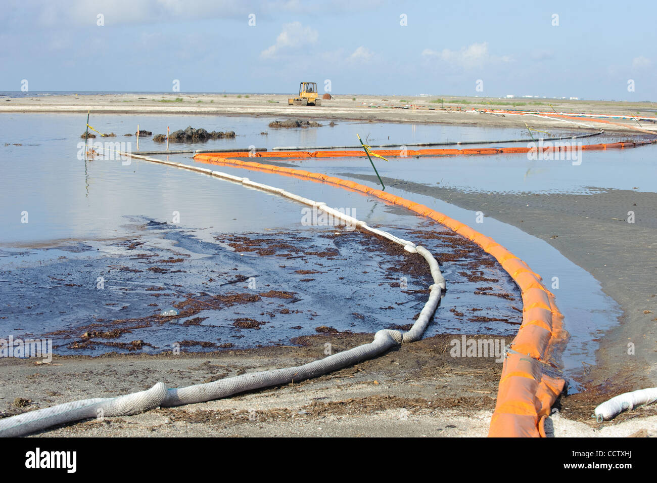 Various types of oil boom used to keep oil out of the marsh behind the ...