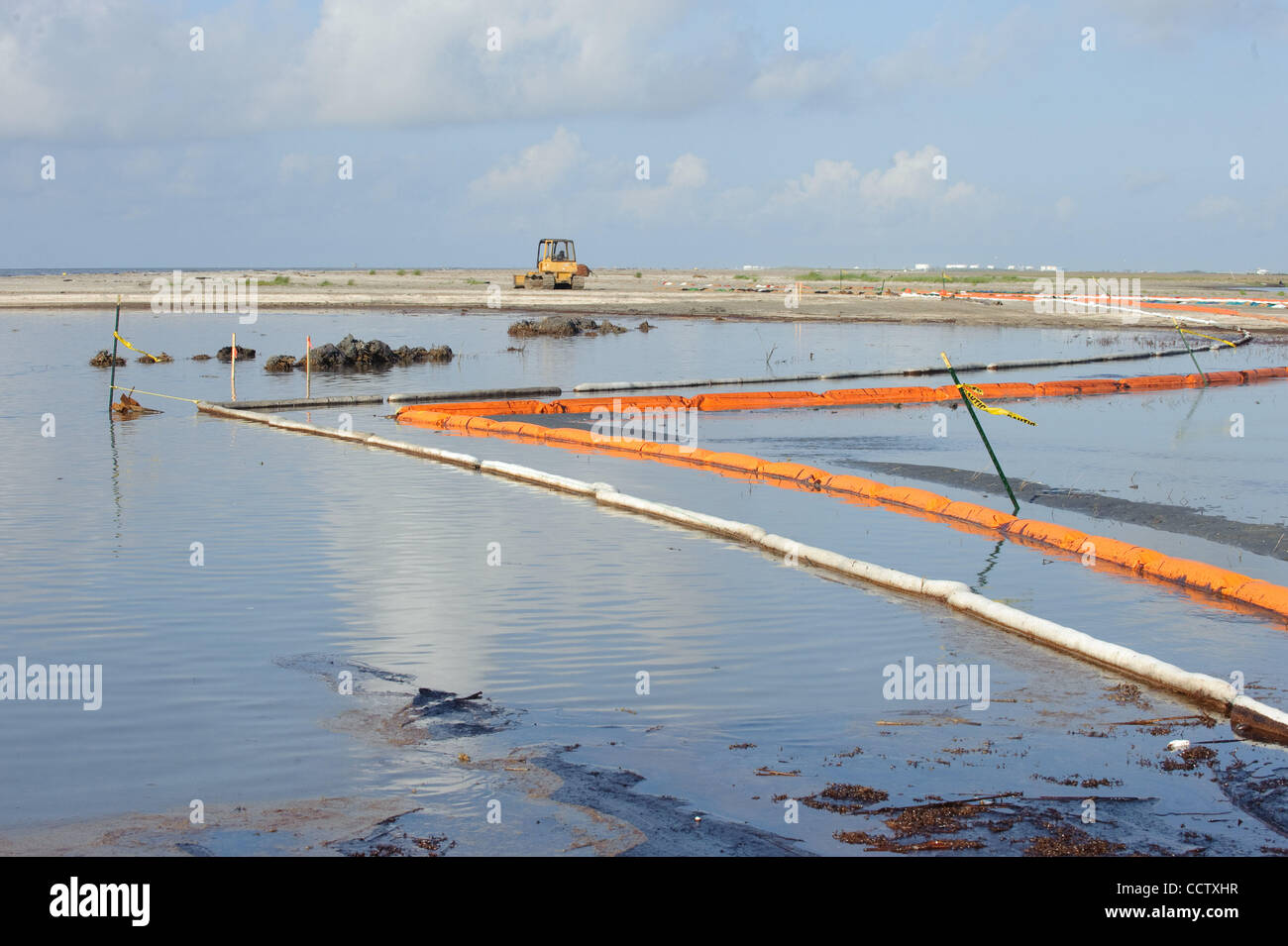 Various types of oil boom used to keep oil out of the marsh behind the ...