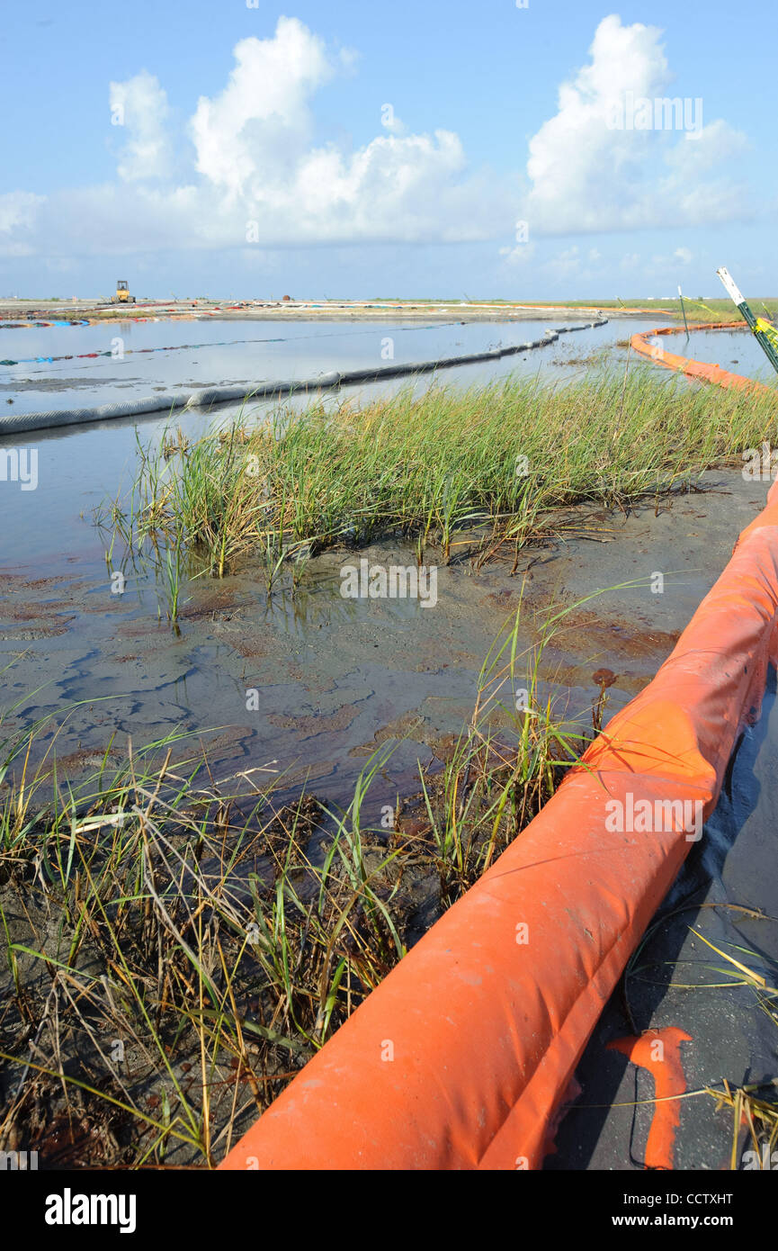 Various types of oil boom used to keep oil out of the marsh behind the ...