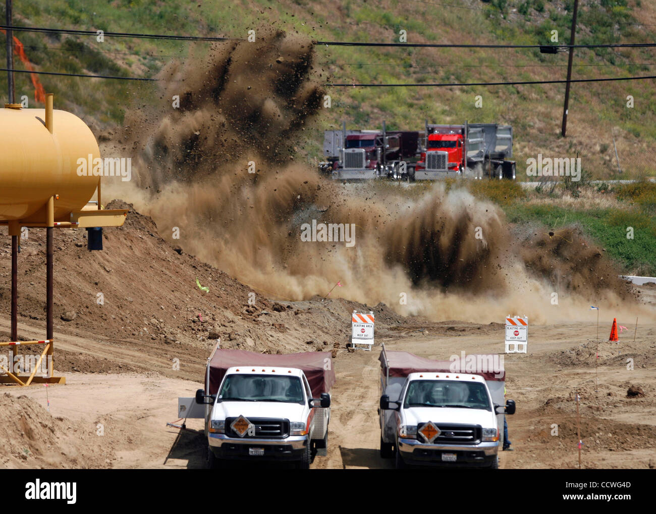 Dirt and rocks shoot skyward as 80 dynamite charges explode as Caltrans ...