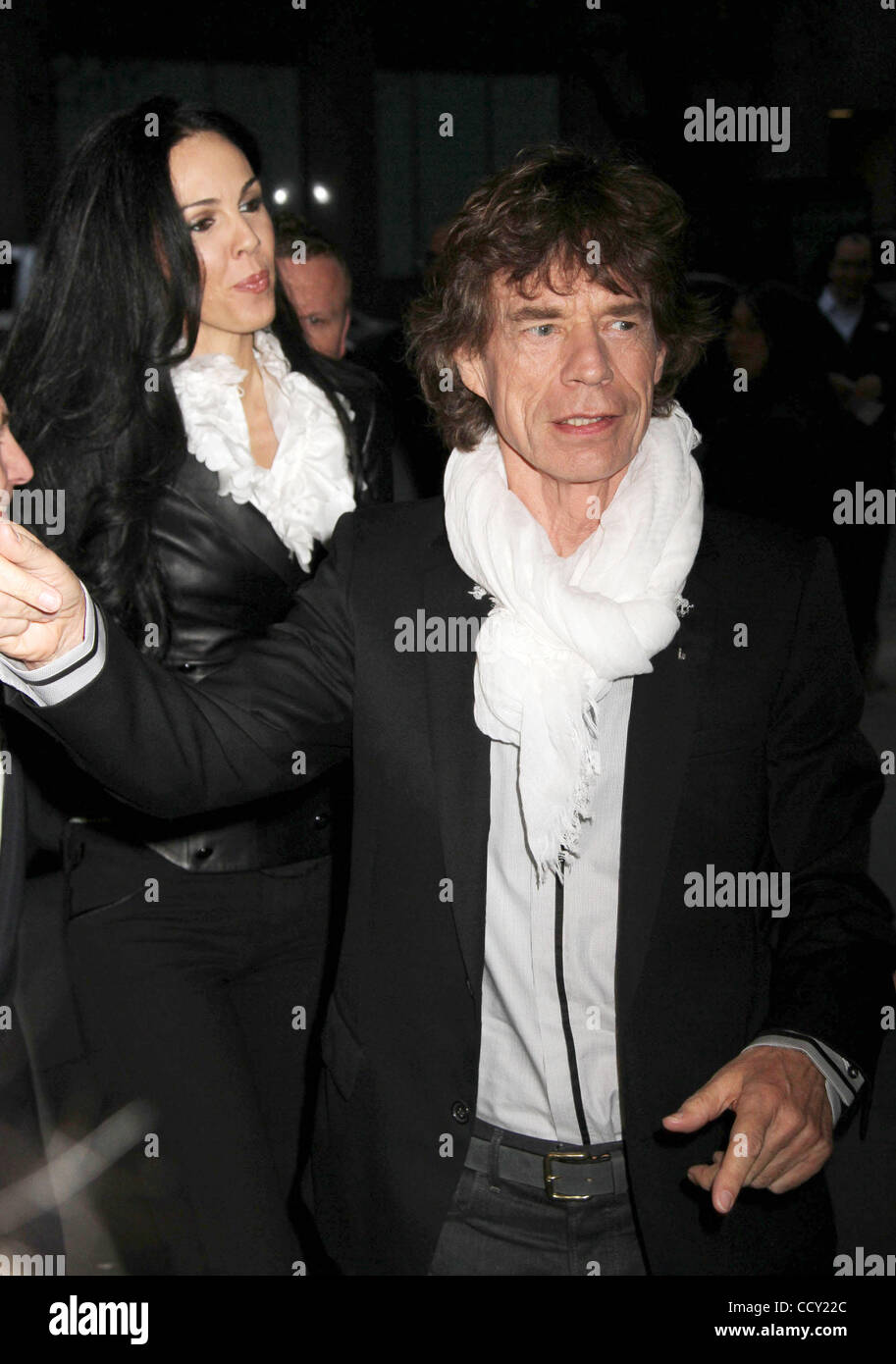 Singer MICK JAGGER and designer L'WREN SCOTT attend the premiere of the ...
