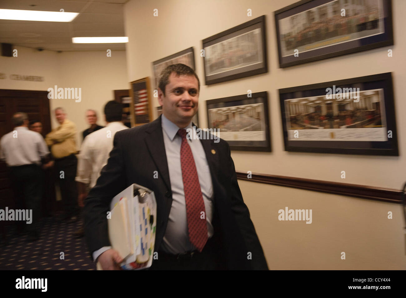 Alaska Representative Chris Tuck (D) heads to the House floor in the ...