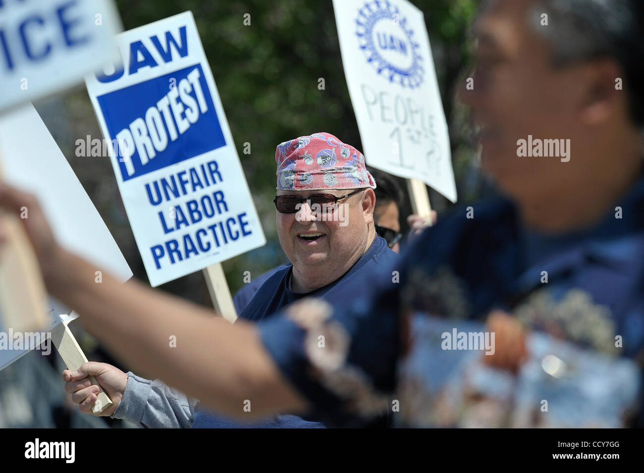 LONG BEACH, CALIF. USA -- Shannon Deveney, a mechanic, protests with ...