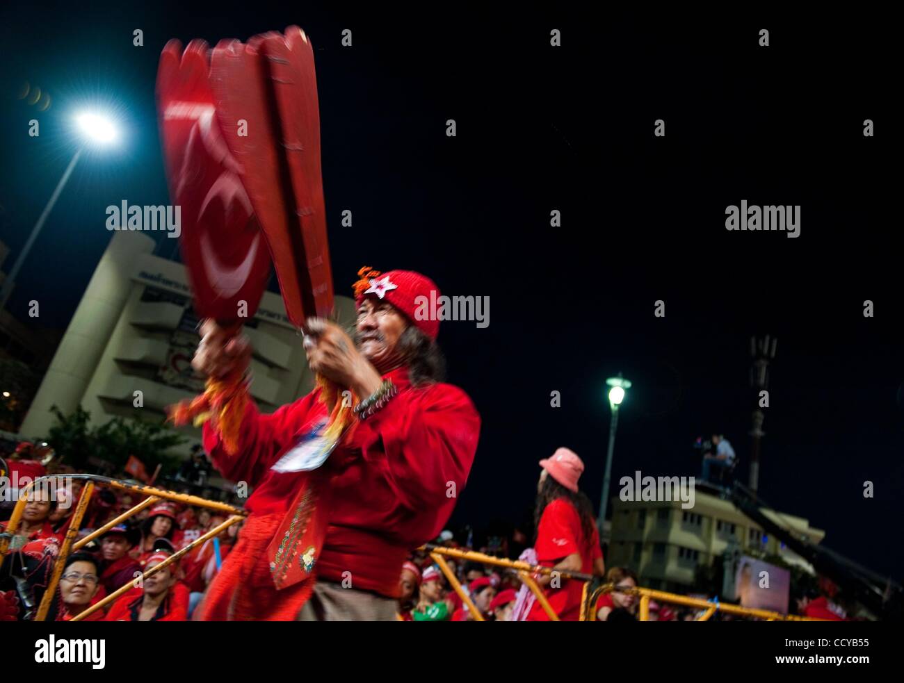 Mar 14, 2010 - Bangkok, Thailand - A Red shirt supporter claps massive ...