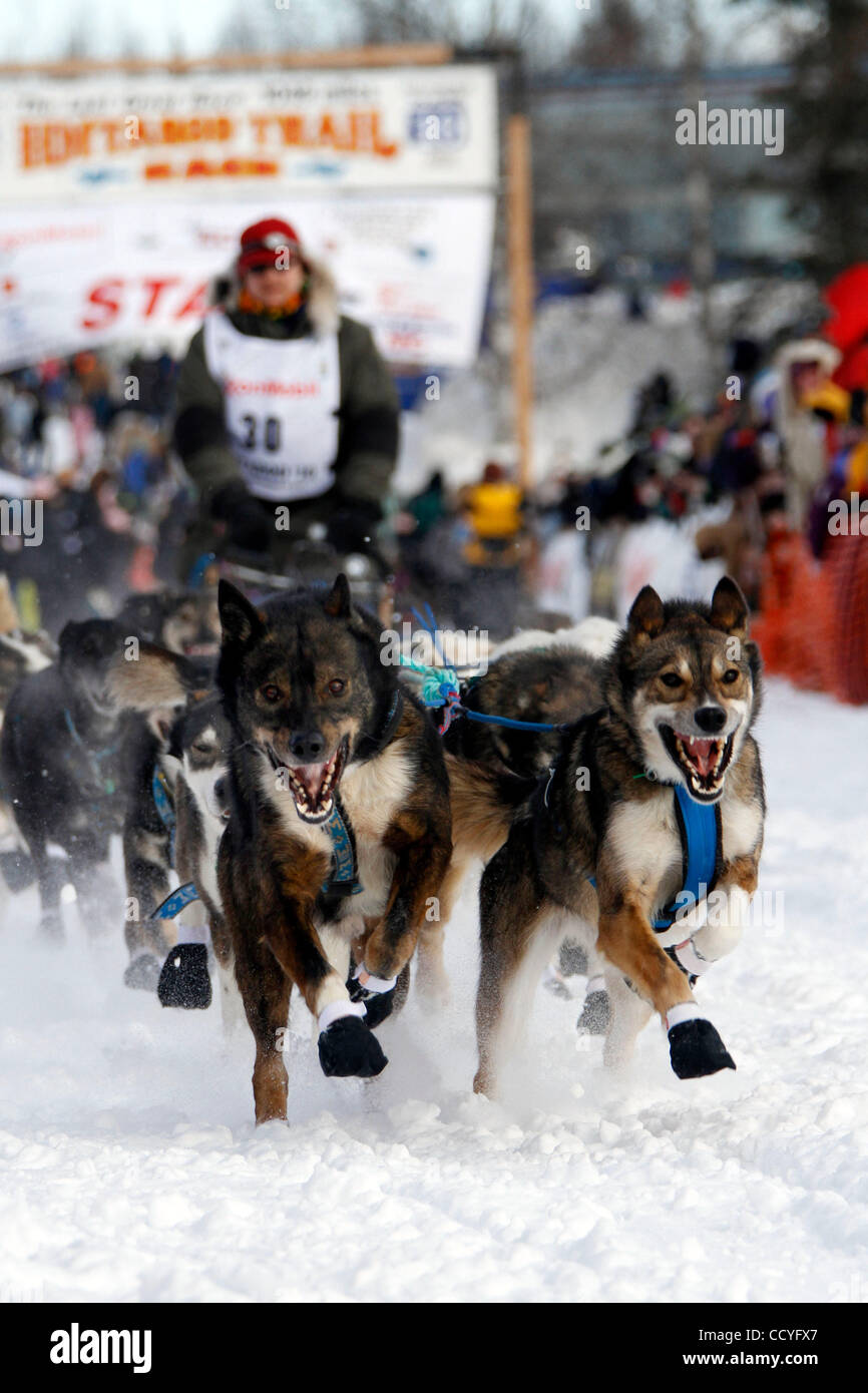 Michael Suprenant's sled dogs race down the starting chute of the ...