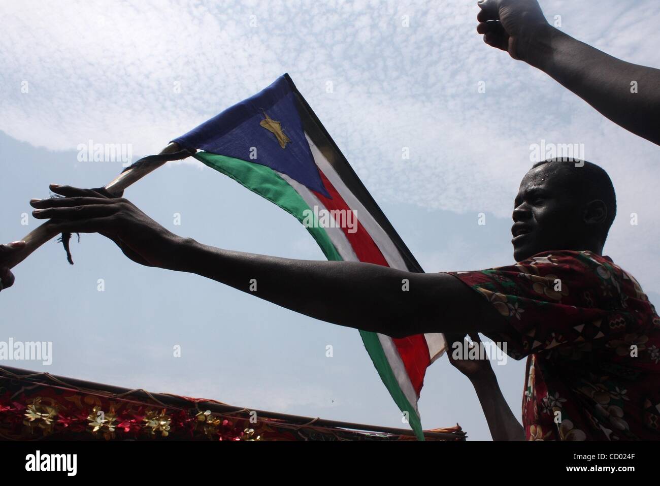 Mar 13, 2010 - Turalei, Sudan - A Sudanese youth waves a Southern Sudan ...