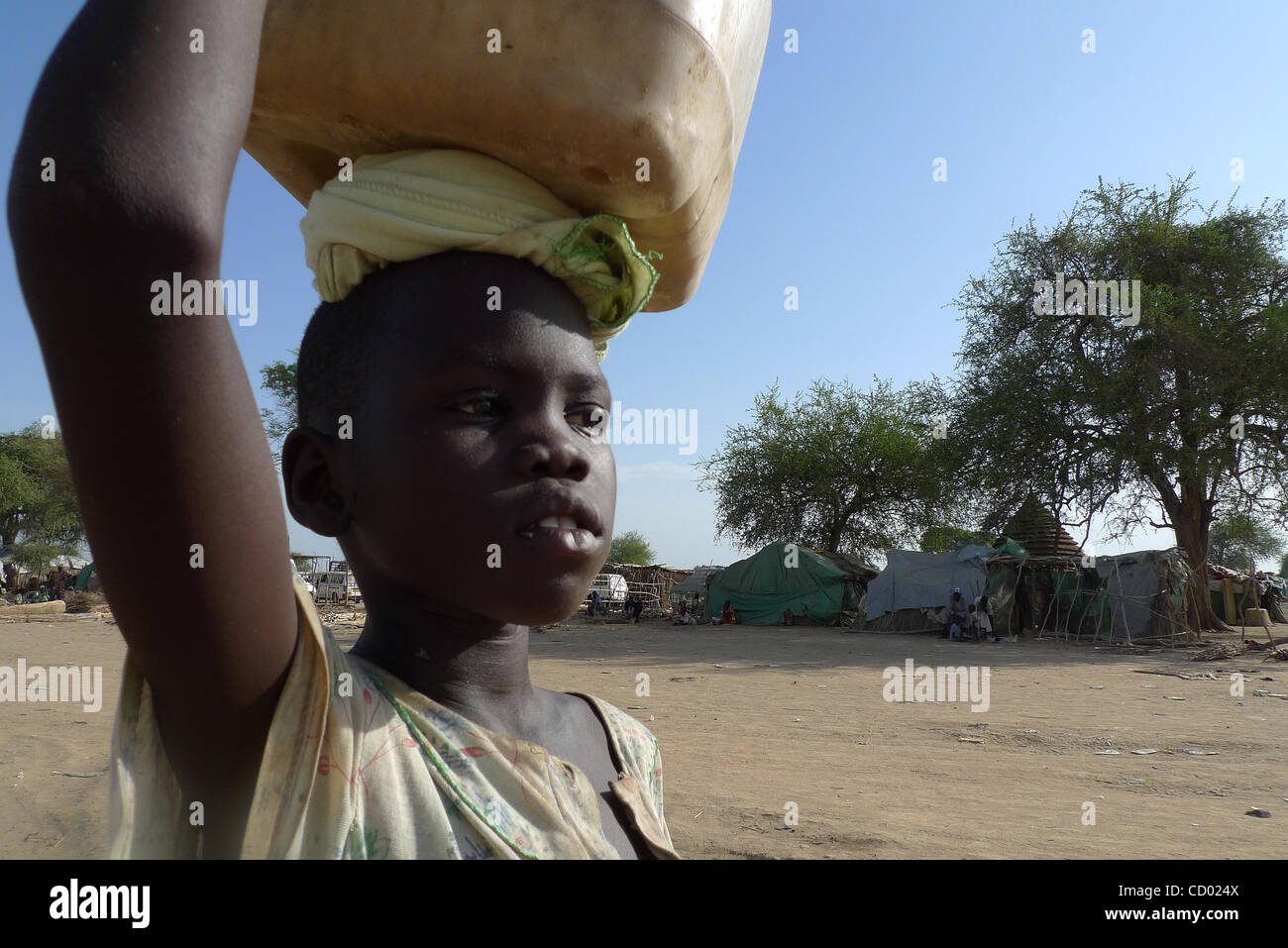 Mar 13, 2010 - Turalei, Sudan - A Sudanese boy carries water home ...