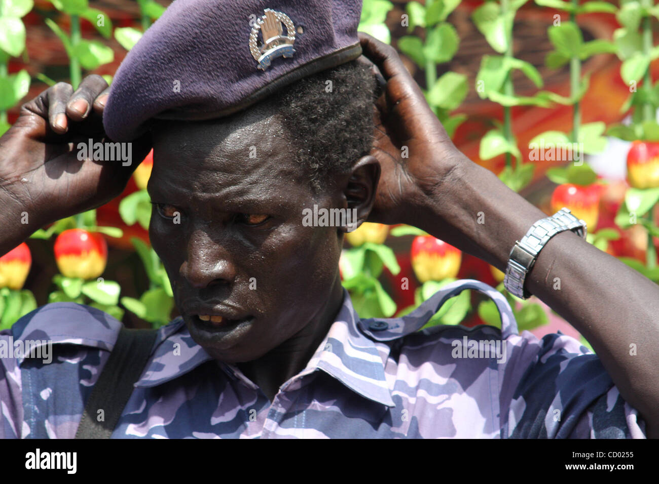 Mar 13, 2010 - Turalei, Sudan - A Sudanese policeman adjusts his cap ...