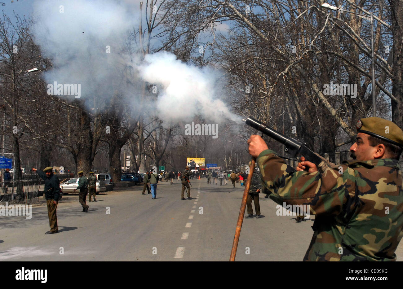 india police man fire tear gas shall during protest ,india police use ...