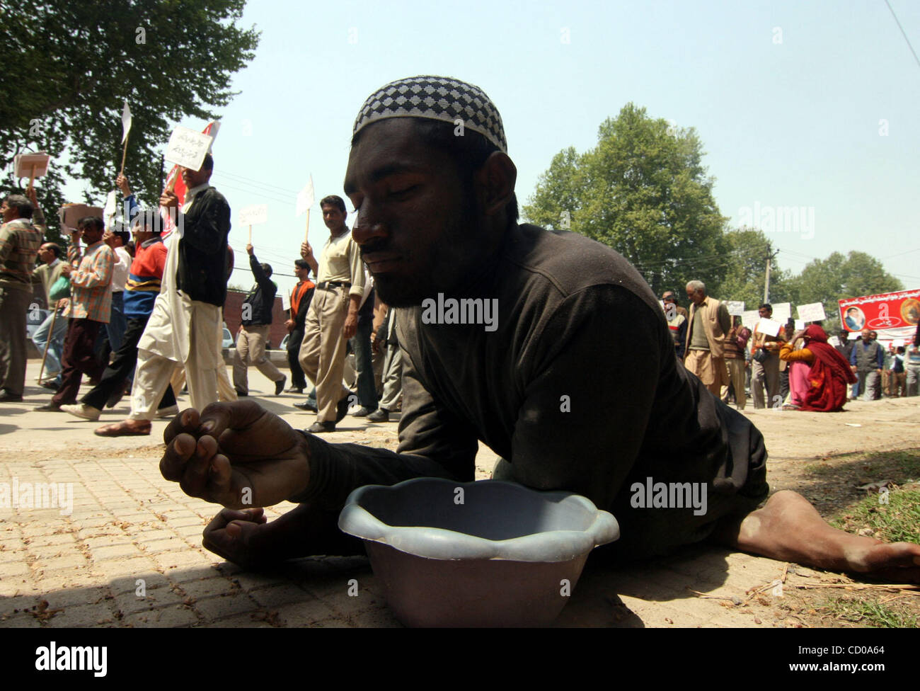 Jammu and kashmir Government employees holding placards(as a beggar ...
