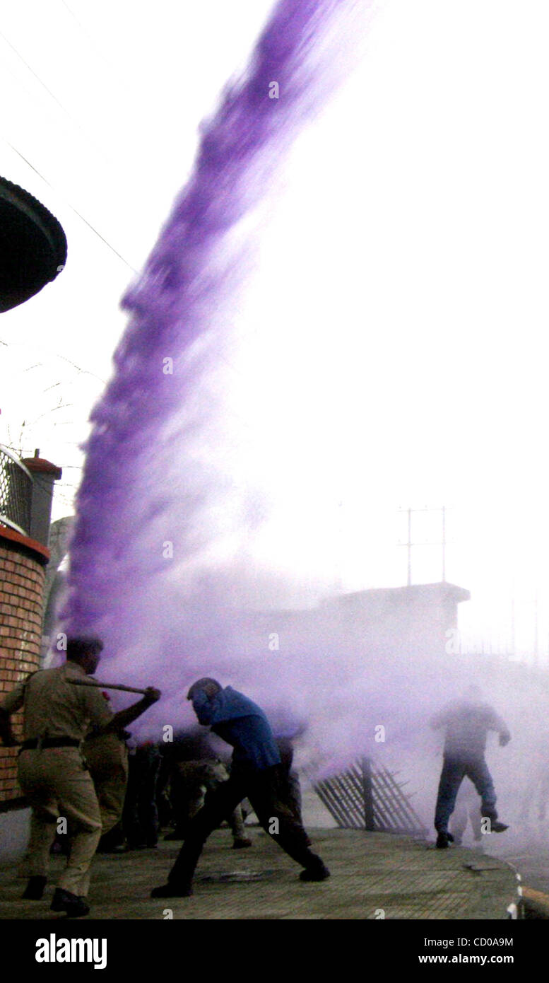Indian Police use water cannons at government employees during a ...