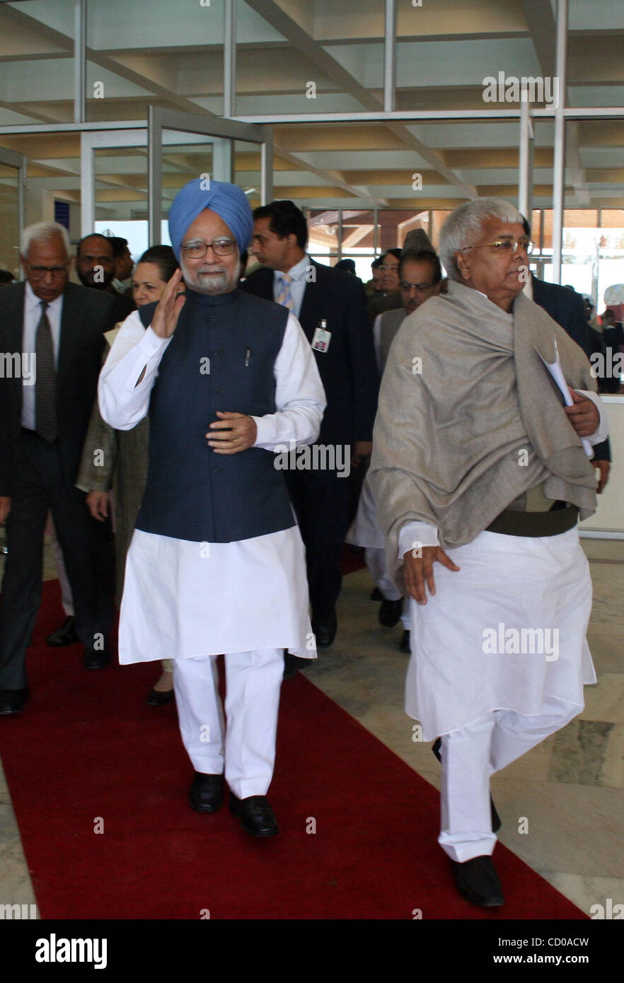 Indian Prime Minister Manmohan Singh (wearing turban), arrives to flag ...