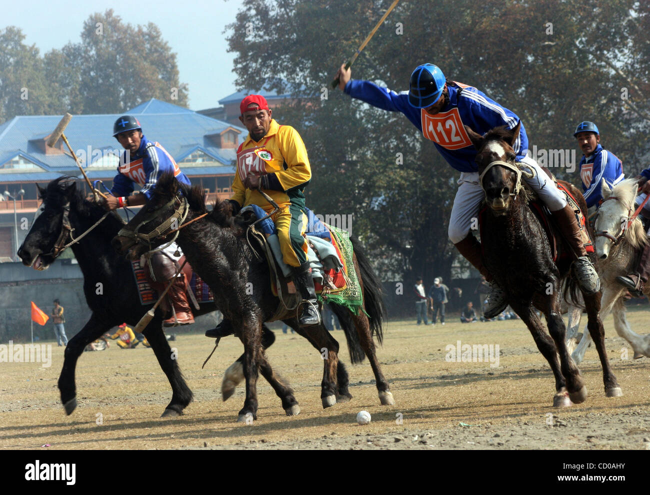 Kashmir Yellow and Kashmir Blue take part in a polo match in Srinagar ...