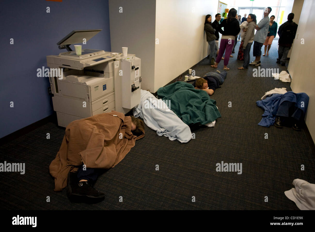 Students sleep in the hallway of Tercero commons area Thursday, March 6 ...