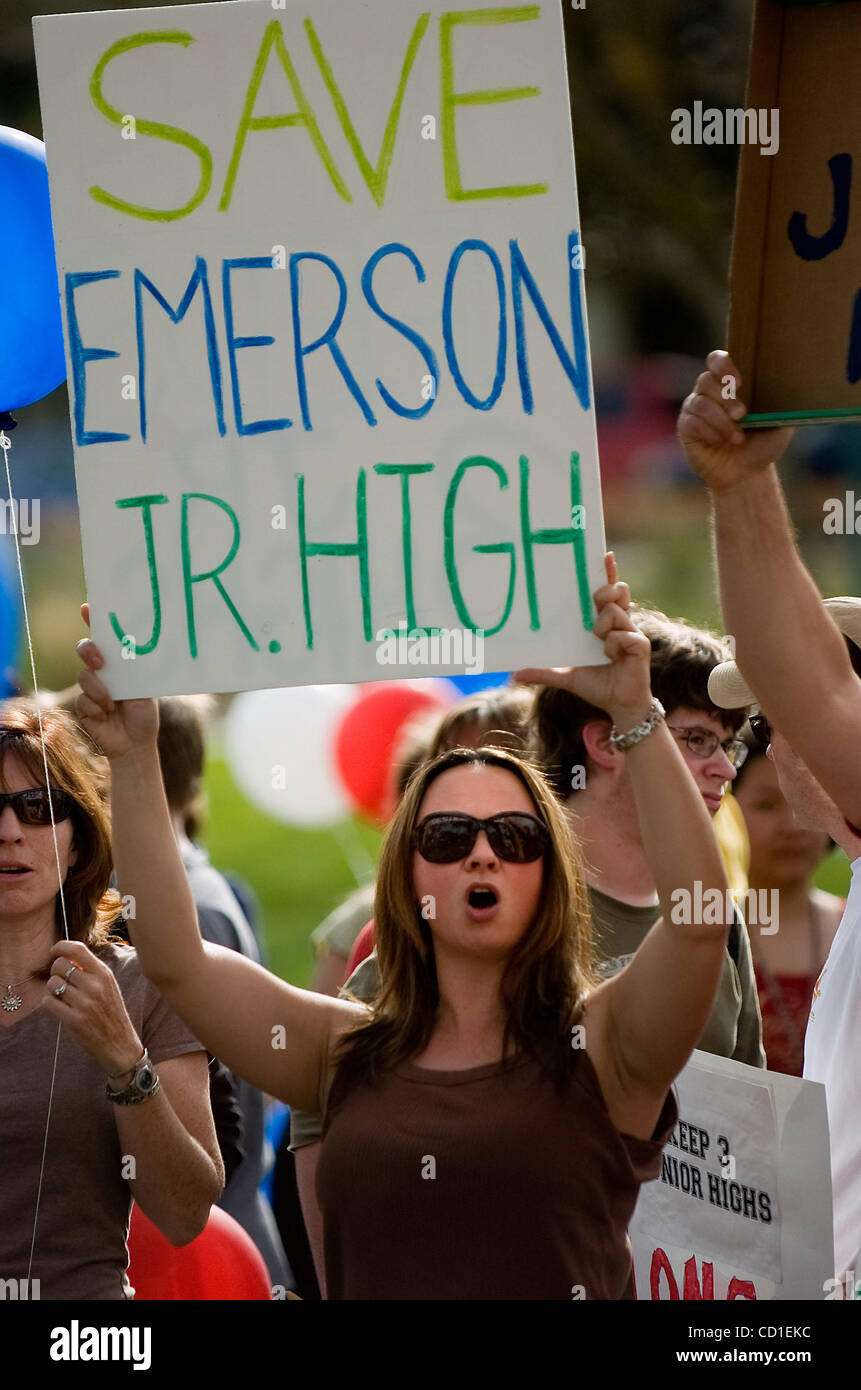 West Davis parent Linda Silverstein (cq) carries a sign and chants ...