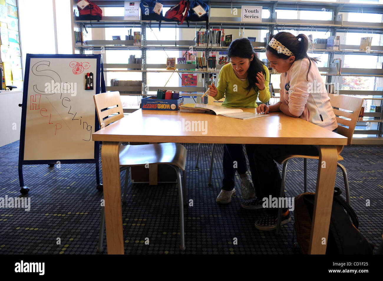 SPELLING BEE -- Josephine Kao, 12, of Roseville, left and her friend ...