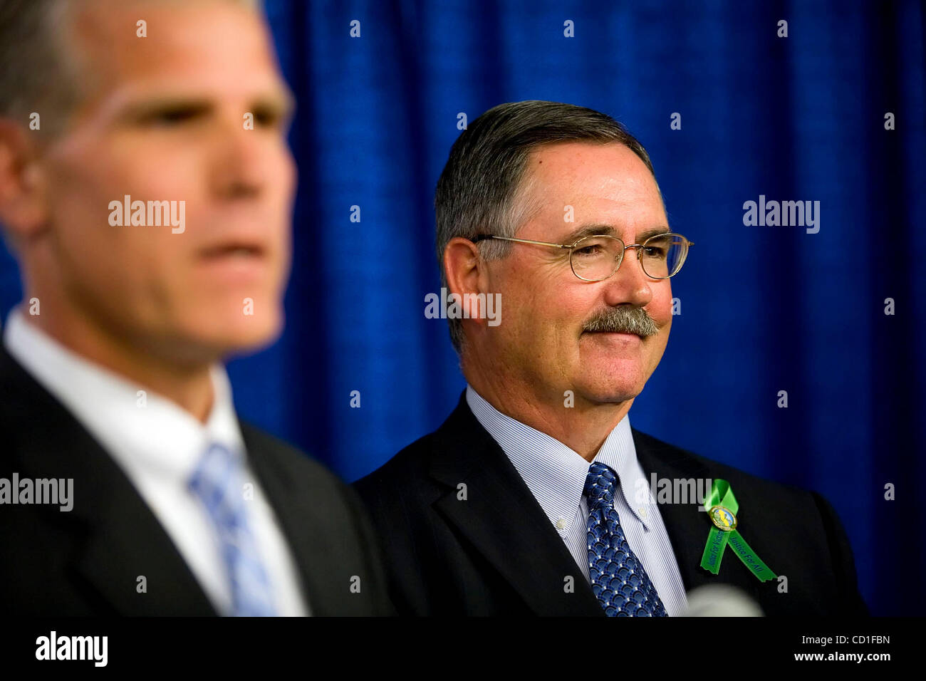 Secretary James Tilton, right listens to Matthew Cate, the new ...