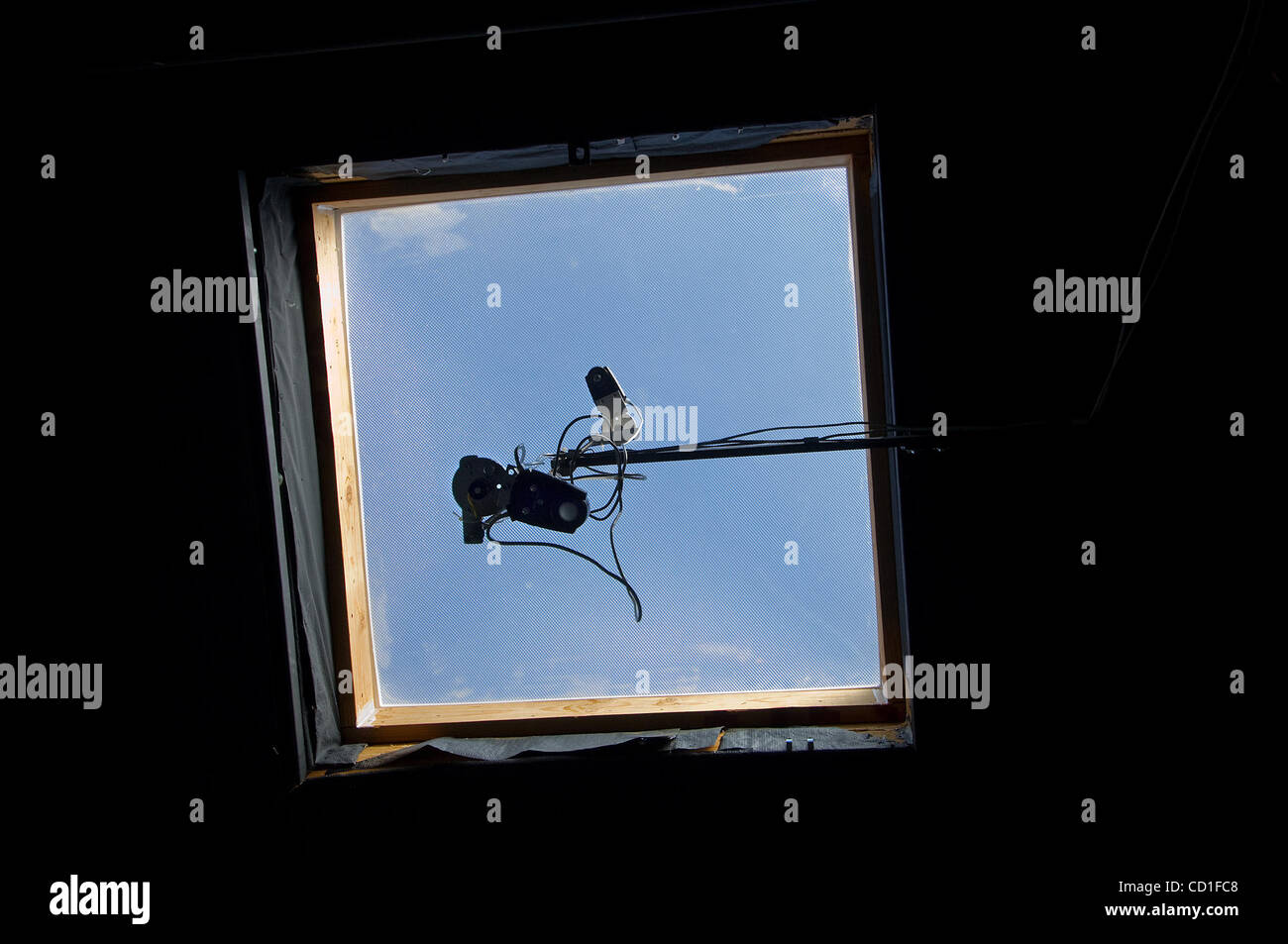Sensors mounted in a skylight measure ambient daylight in a lab at the ...