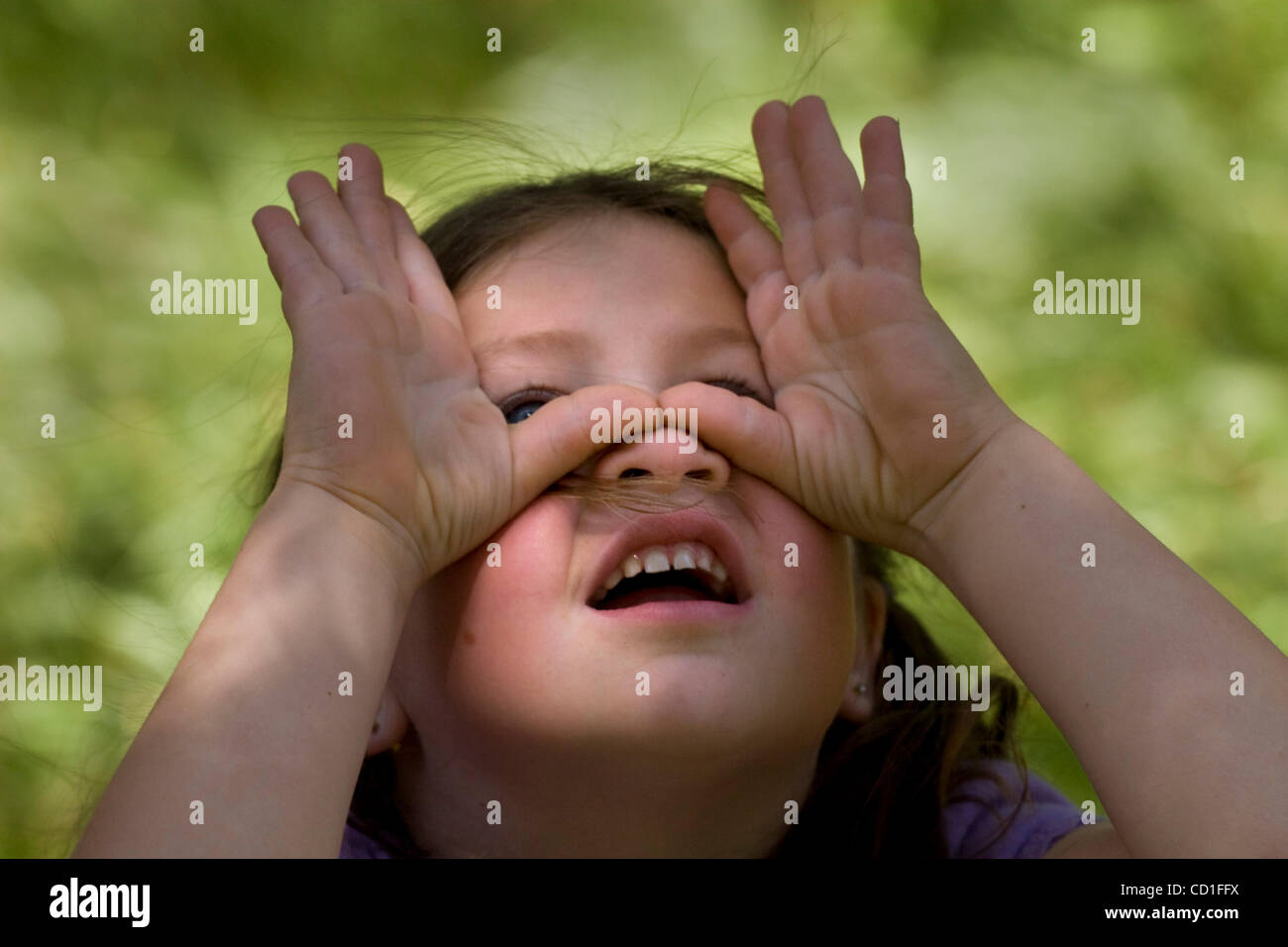 Madison Gravitt (cq) , 5, uses her pretend binoculars to look at birds ...