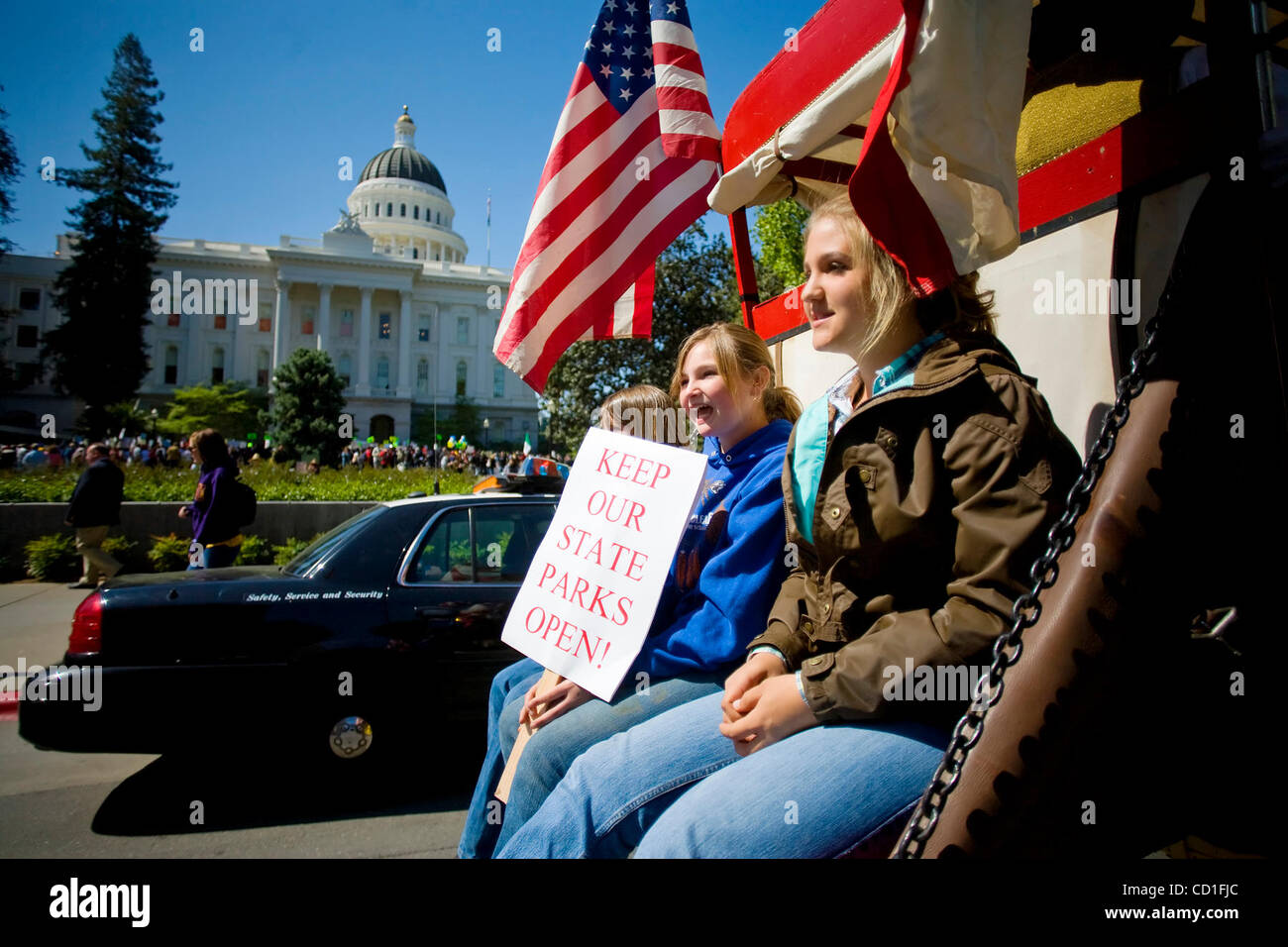Dakota Shinn, 8, Taylor Shinn, 12 and Katie Shinn, 15, ride on the back ...