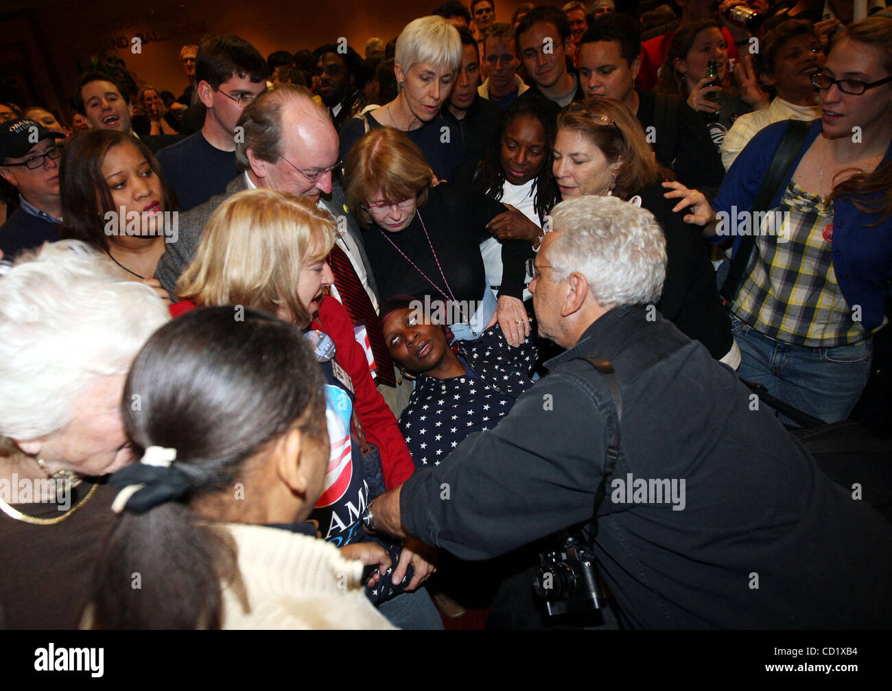 A Obama supporters faints as she was overcome by the excitment of ...