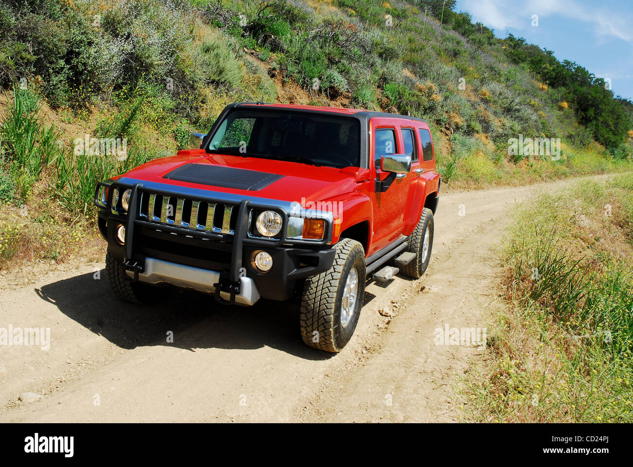 Lifted Red Hummer H3