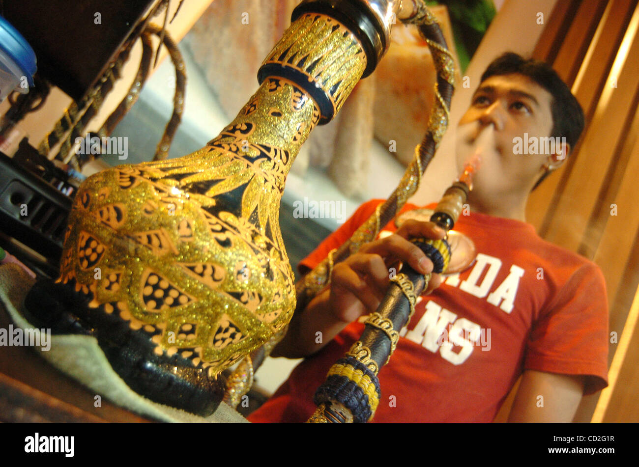 Mar 02, 2008 - Surabaya, East Java, Indonesia - A man puffs Hookah, or ...