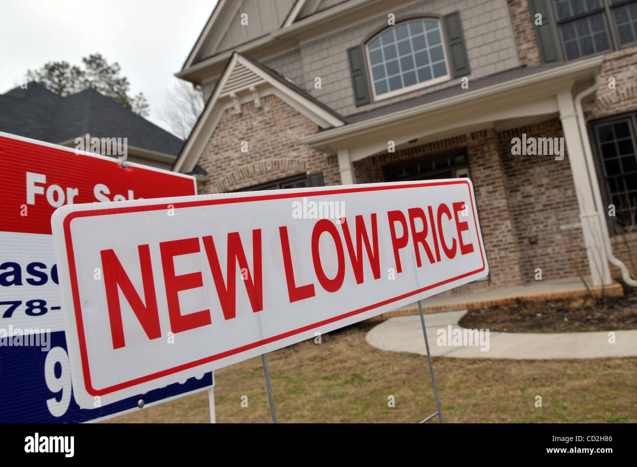 Atlanta, GA -- 'New Low Price' sign outside existing house that has ...