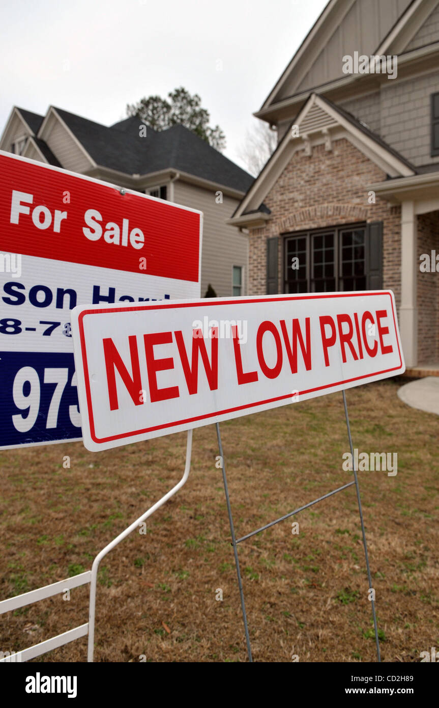 Atlanta, GA -- 'New Low Price' sign outside existing house that has ...