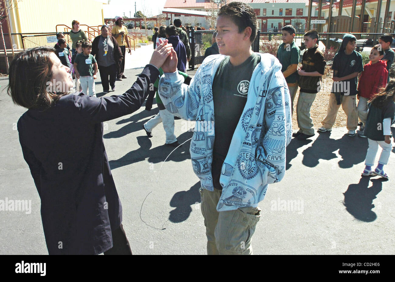 ACORN Woodland Elementary School Principal Kimi Kean high-fives 5th ...