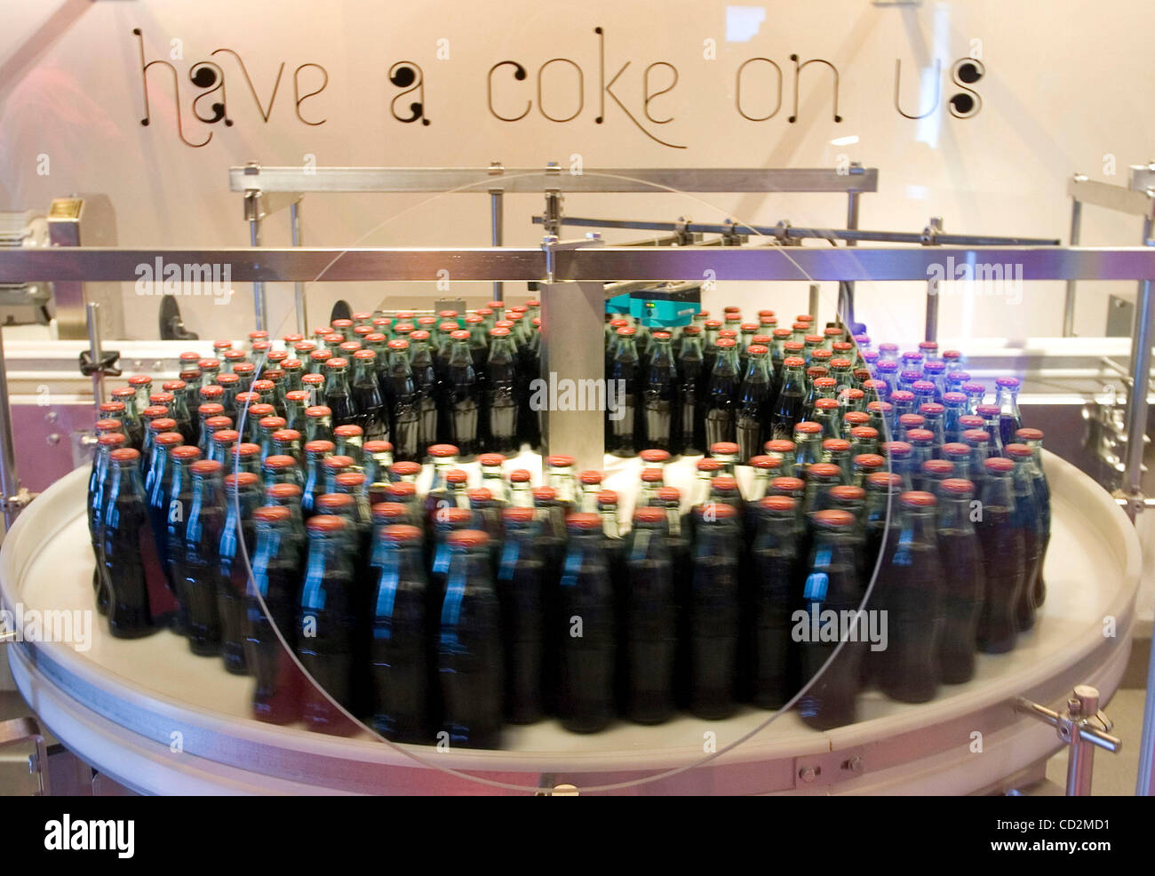Bottles of Coca-Cola for the taking by visitors rotate around at the ...