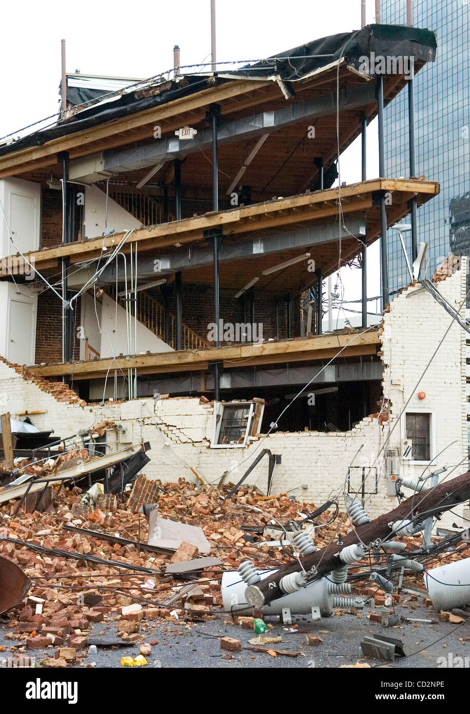 A partially collapsed building after an apparent tornado ripped through ...