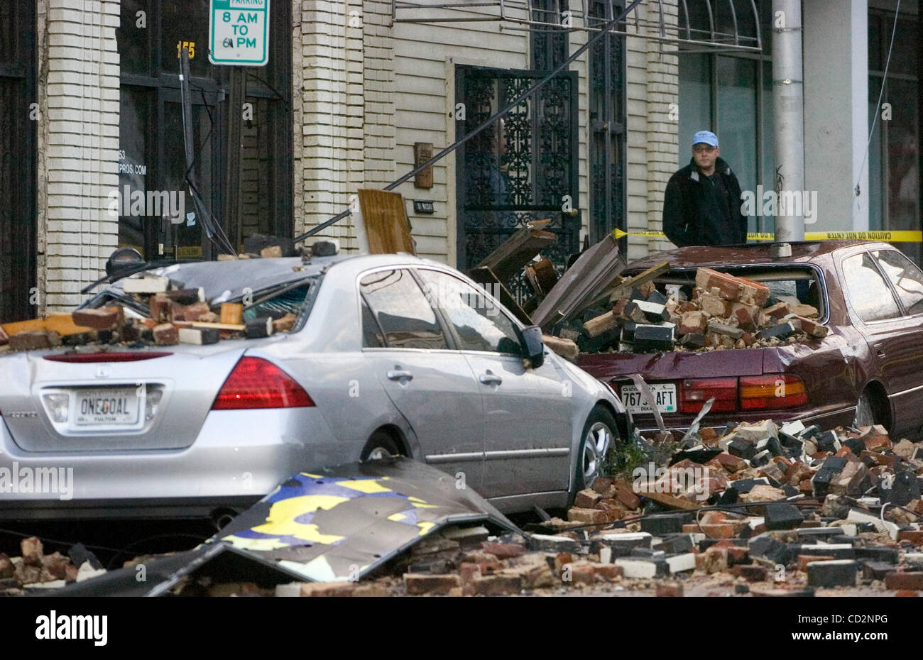 A pair of cars were crushed by the collapse of a building after an ...