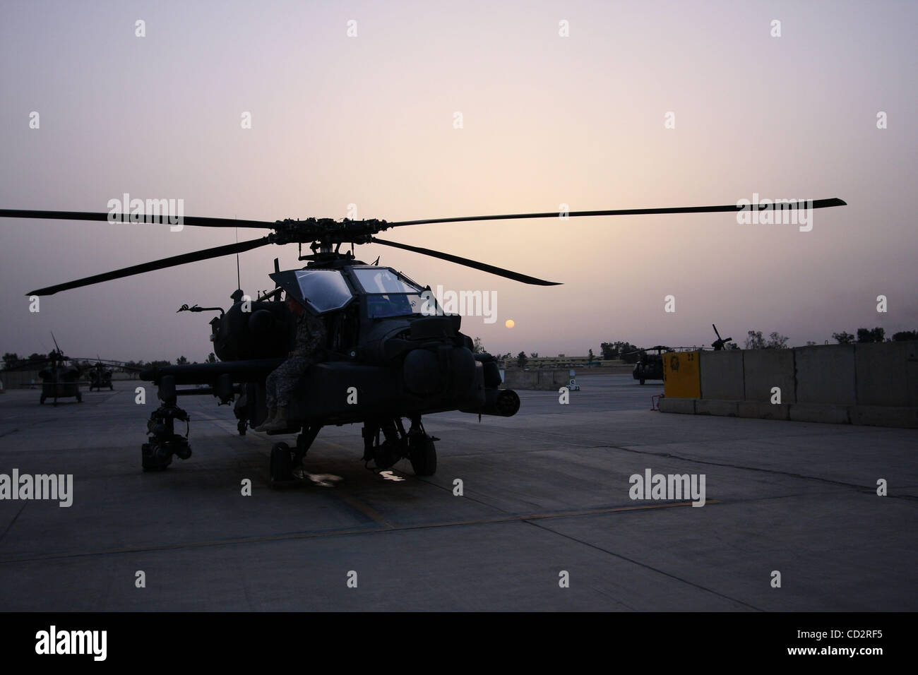 Mar 19, 2008 - Camp Taji, Taji, Iraq - The sun rises behind an AH-64 ...