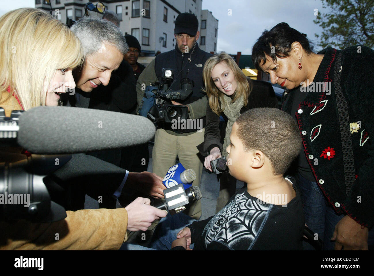 Christopher Rodriguez, 10, right, is interviewed by reporters on his ...