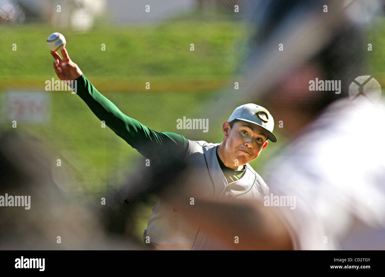 Capuchino pitcher Danny Macedo delivers a pitch to a Mills batter in ...