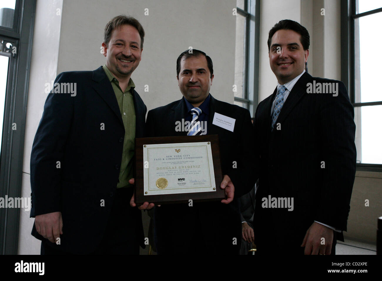 L/R: Daily News reporter Peter Donohue, cab driver Douglas Guldeniz and ...