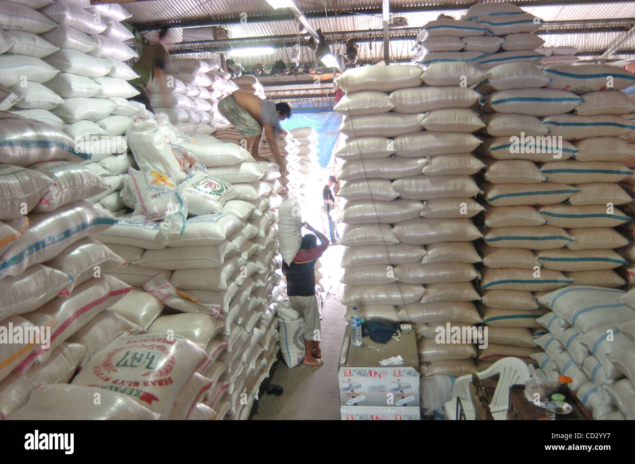 A rice seller prepares rice sack for sale in Jakarta,Indonesia, March ...