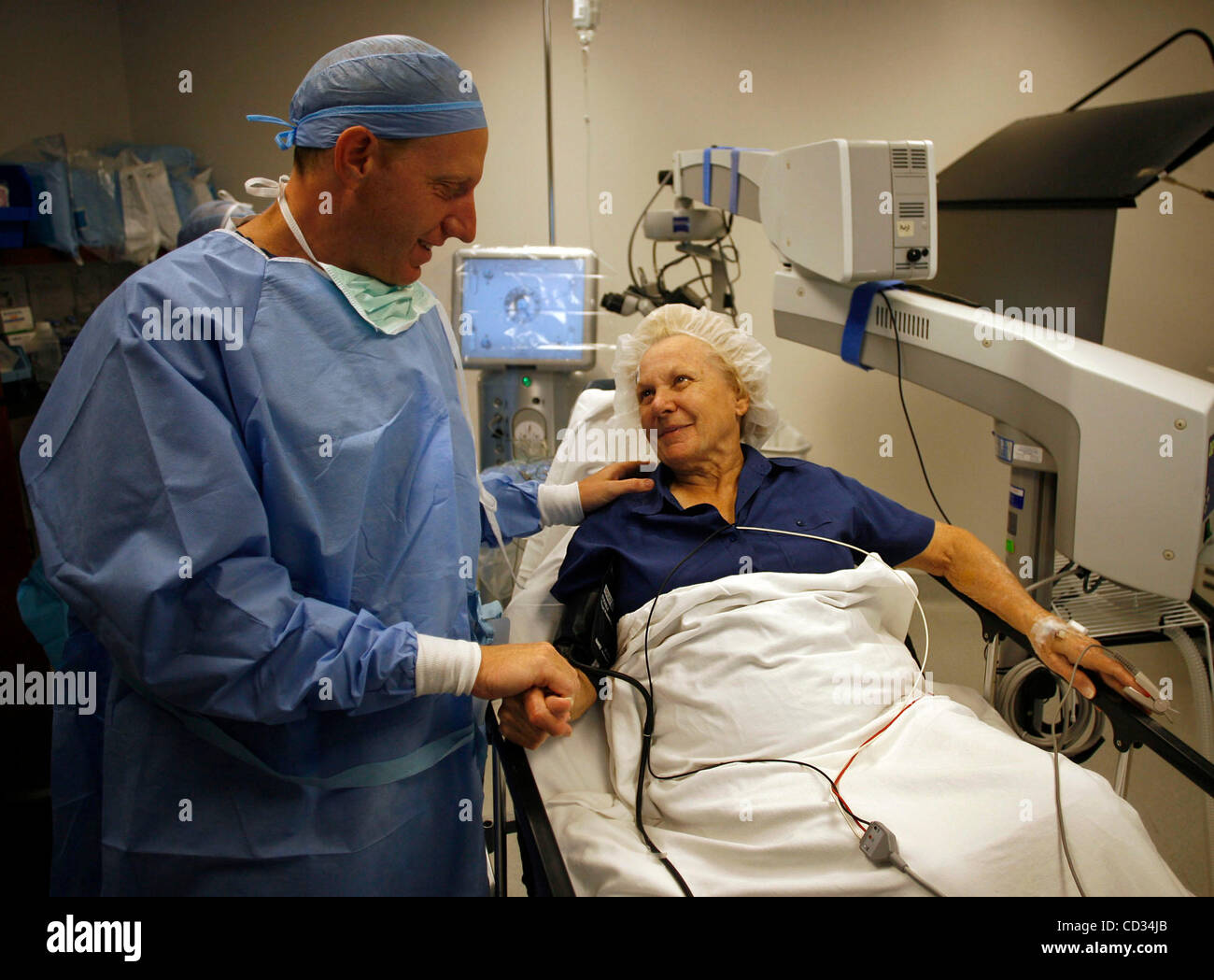 Dr. Robert J. Weinstock talks to Caroline LaBonte after he removed a ...