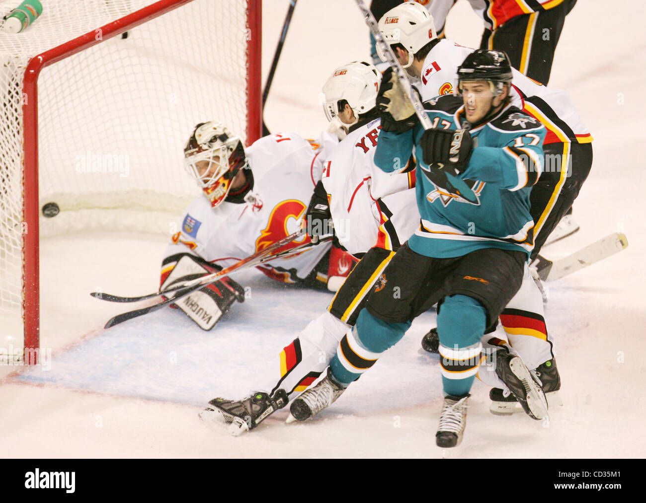 The Sharks Torrey Mitchell (17) scores a second period goal past Flames ...