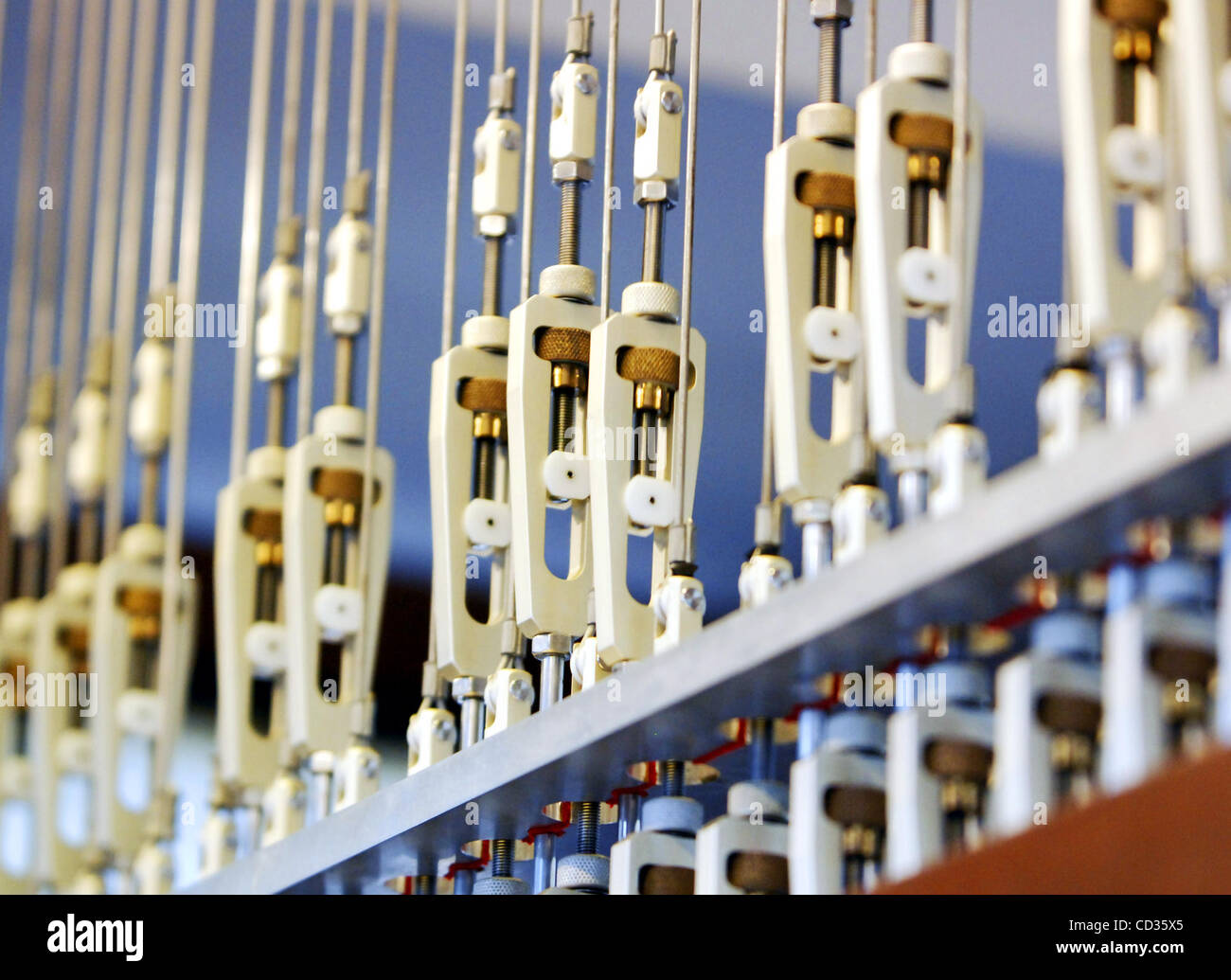 Wires connect the the baton keys of a carillon keyboard to the clappers ...