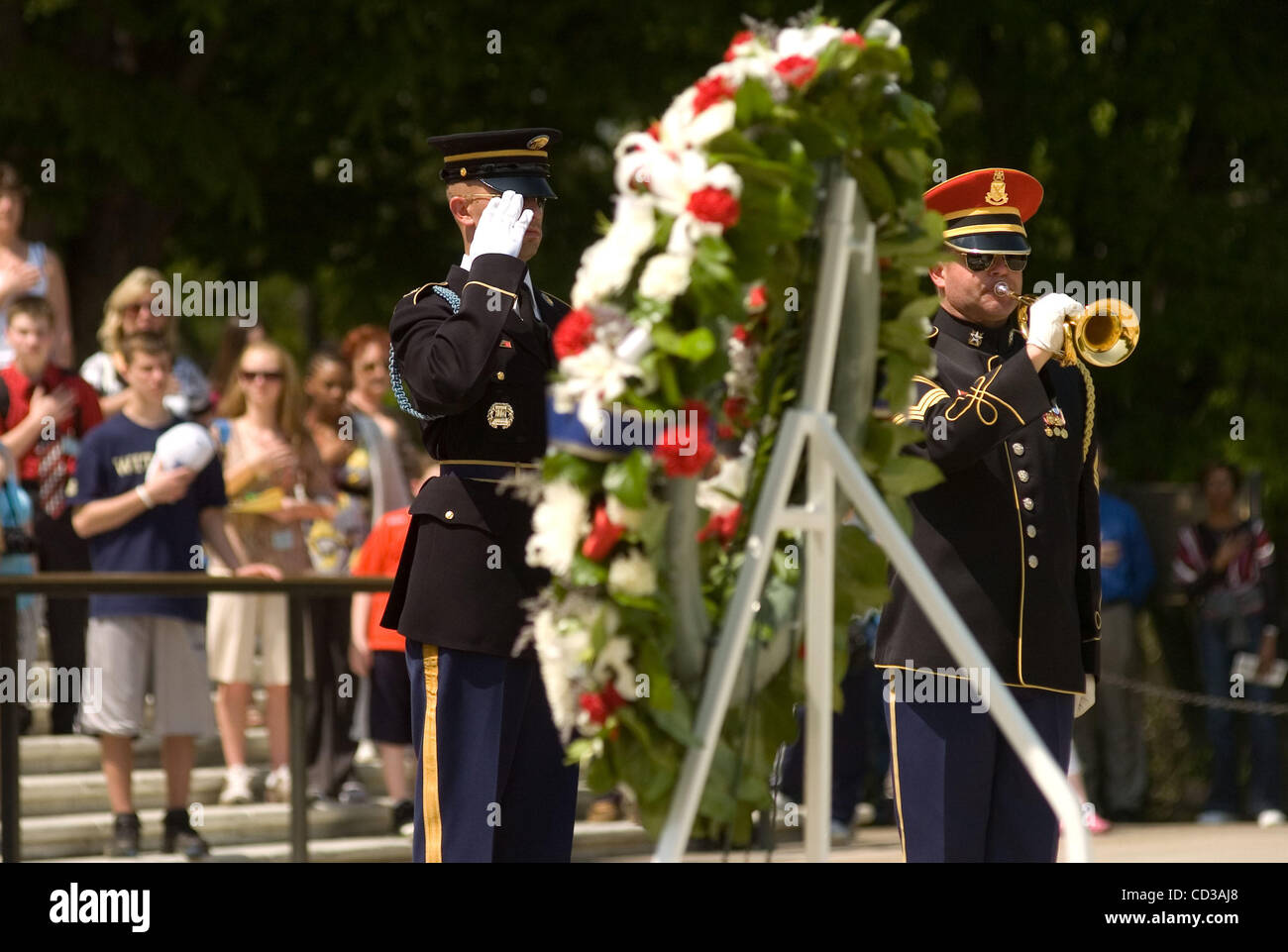 Taps is played during a ceremony at Arlington National Cemetery ...
