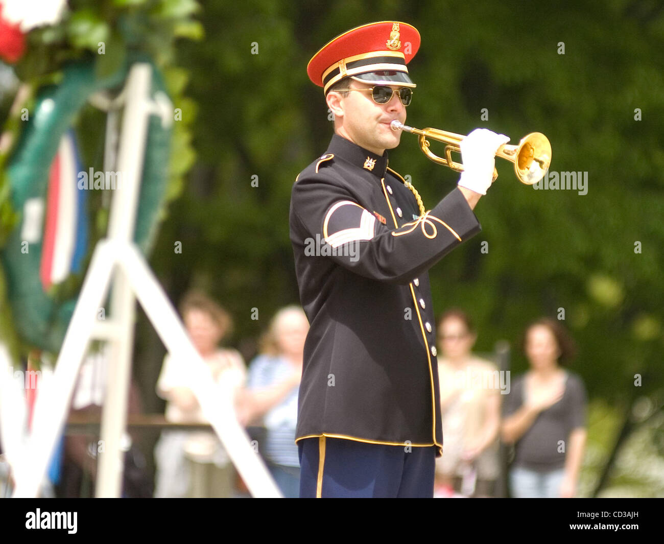 Taps is played during a ceremony at Arlington National Cemetery ...