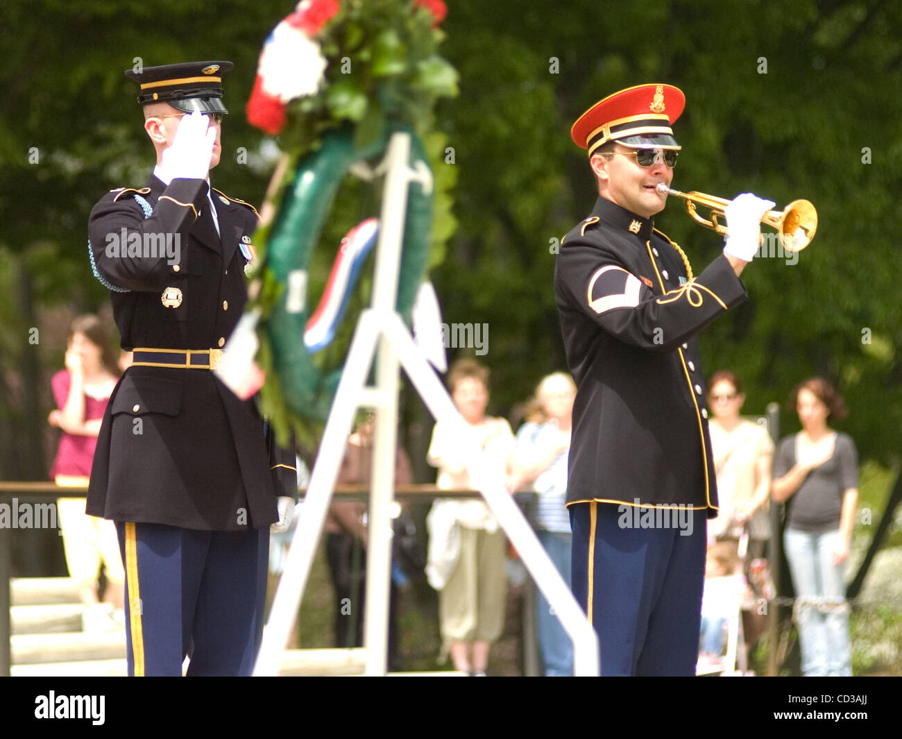 Taps is played during a ceremony at Arlington National Cemetery ...