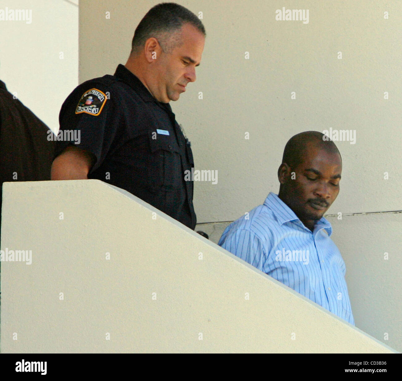 ( LARGO 4/24/2008 ) photo #1.) Largo Police officer Jim Shinn walks ...
