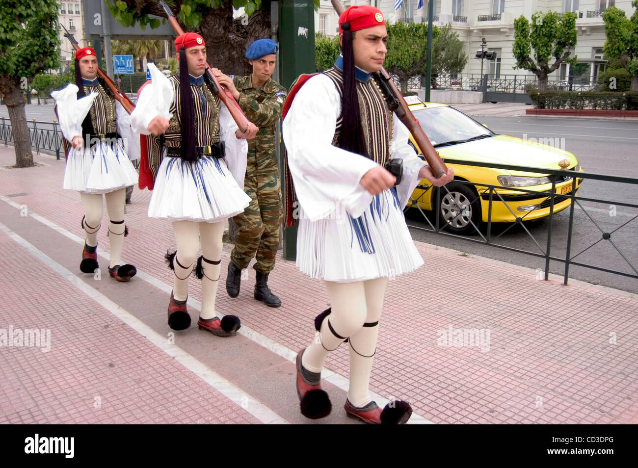 Greek soldiers march during a traditional militaristic duty take-over ...