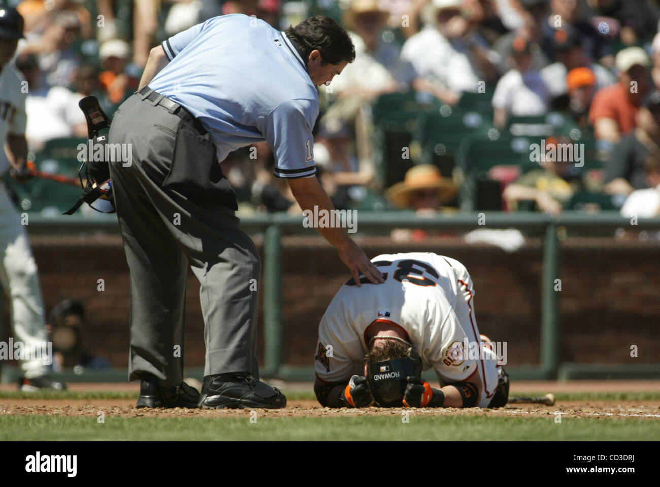 With home plate umpire Ed Rapuano standing by him, Giants' batter Aaron ...