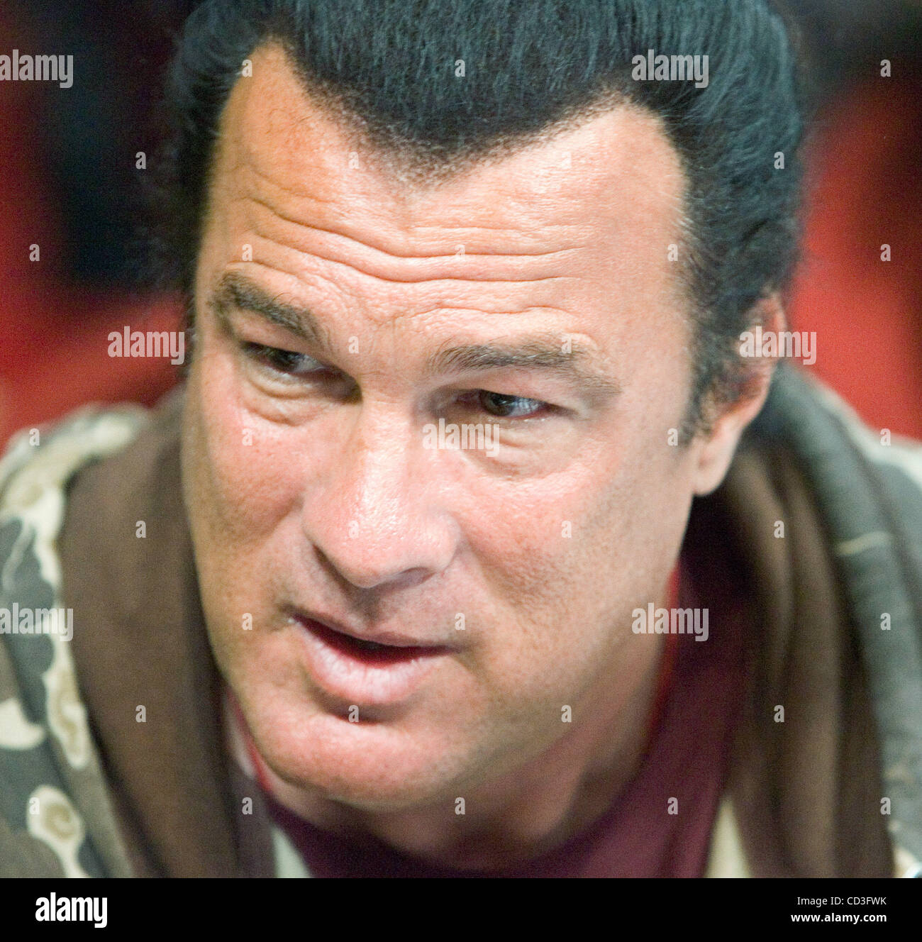 Actor, musician and martial arts expert Steven Segal sits at ringside ...