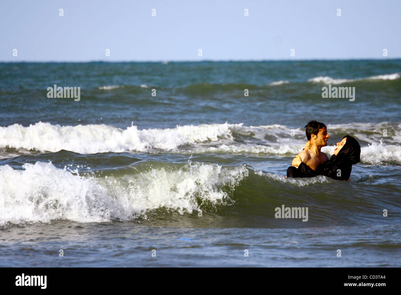 2008/06/05: An Iranian couple swims in Caspian Sea in Bandar-e Anzali ...